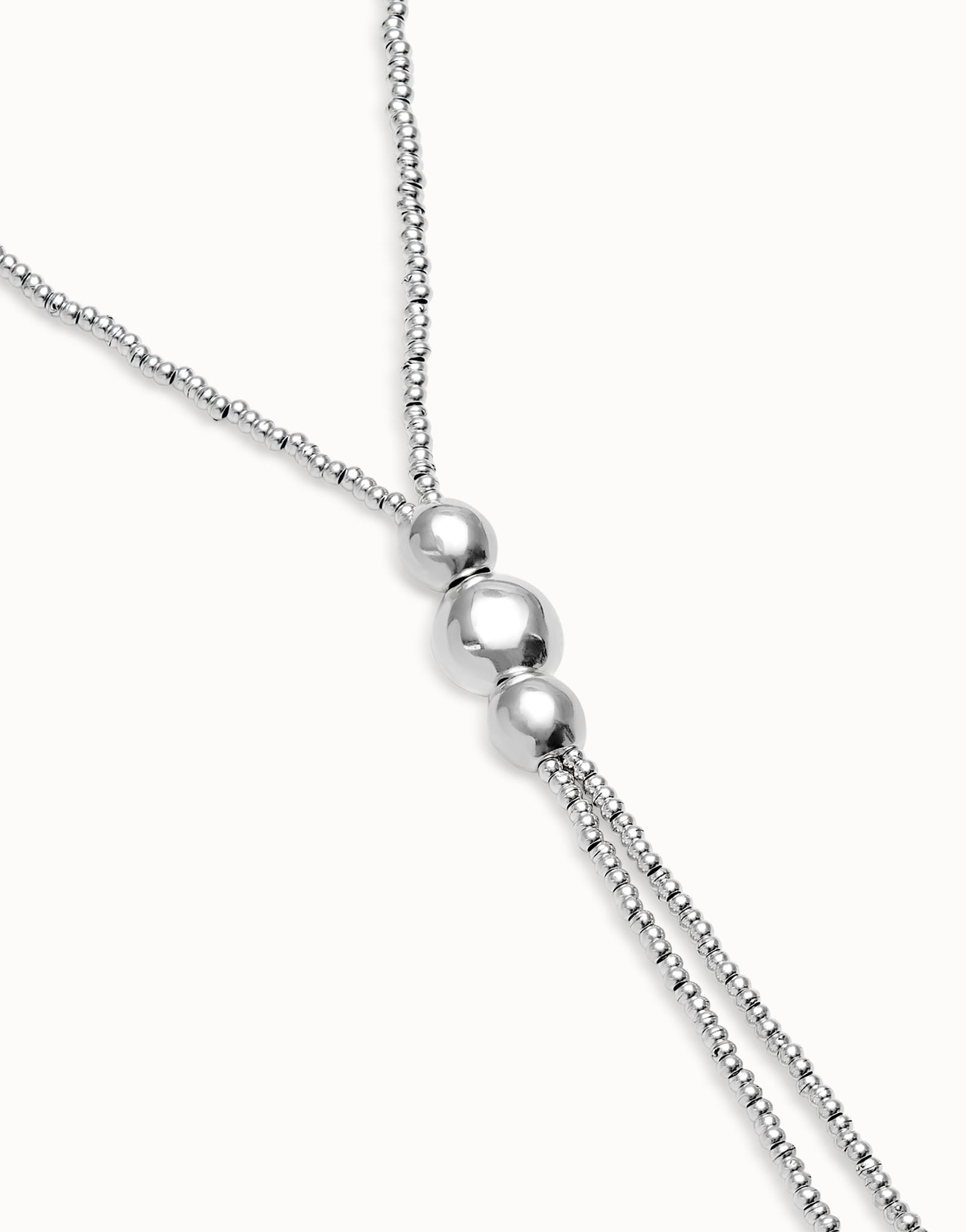 Long sterling silver-plated bead pendant with three larger central beads